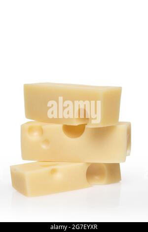 A vertical shot of Swiss cheese slices with rosemary on a plate on an ...