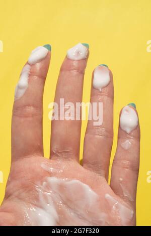 Moisturizing gel on the palm of female hand isolated on white ...
