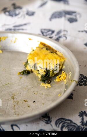 Plate with piece of delicious cheese pie on white table Stock Photo - Alamy