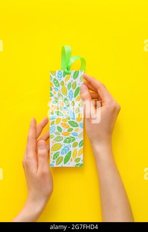 Woman with bookmarks on color background Stock Photo - Alamy