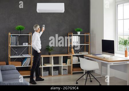 Modern wall-mounted air conditioner installed in a room, providing ...