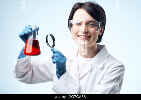 woman scientist chemical solution magnifier research Stock Photo - Alamy