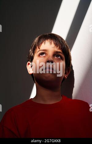 Suffering child with bruises on the face and swollen, bruised eye ...