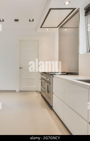 Cozy kitchen zone with in a spacious apartment Stock Photo - Alamy