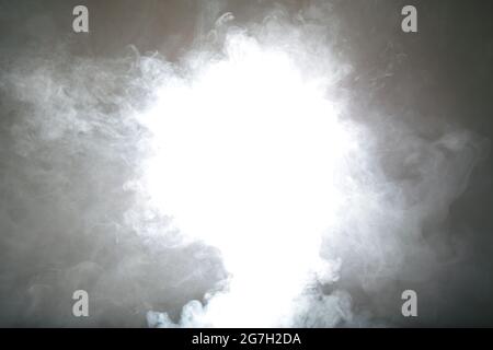 Artificial magic light illuminates smoke isolated on dark background ...