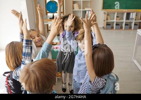 Group of children put their hands together. Teamwork concept Stock ...