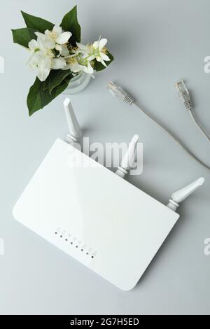 Wi-Fi router and flowers on yellow background Stock Photo - Alamy