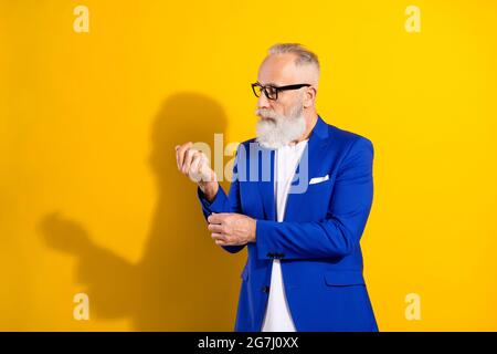Photo of charming serious age gentleman wear orange shirt showing palms ...