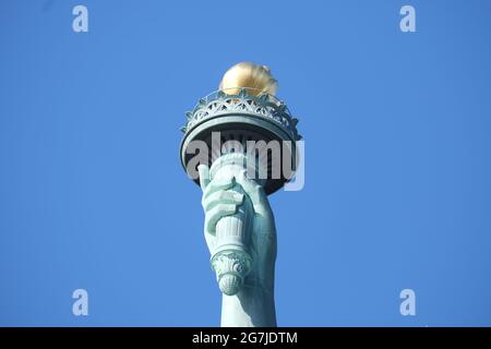 The Statue of Libertys torch is a symbol of freedom and democracy ...