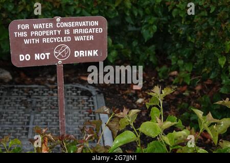 water conservation recycled water irrigation sign . do not drink water ...