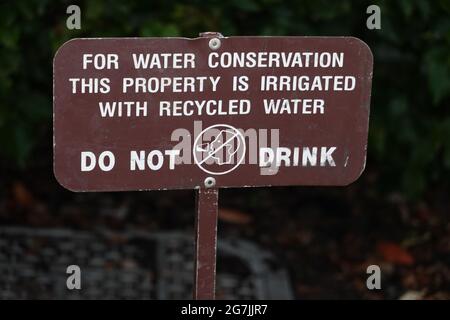 water conservation recycled water irrigation sign . do not drink water ...