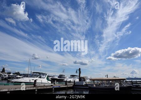 Beautiful mixed cumulus and cirrus clouds on a deep blue summer sky ...