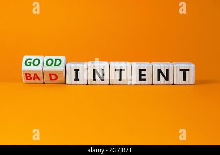 Good or bad intent symbol. Turned wooden cubes and changed concept ...