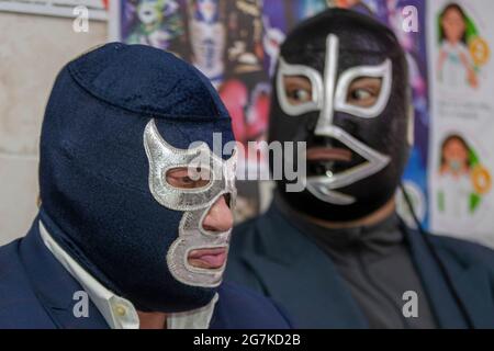 MEXICO CITY, MEXICO - JULY 14: Wrestlers (L-R) Espectro Jr, Hijo del ...