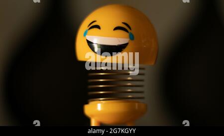 Plastic bouncing happy smiley on a blurred background Stock Photo - Alamy