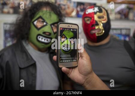 MEXICO CITY, MEXICO - JULY 14: Wrestlers (L-R) Espectro Jr, Hijo del ...