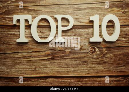 Top 10 alphabet letters with space for copy on wooden background Stock ...