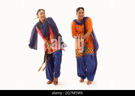Two Giddha Dancers performing a dance step together Stock Photo - Alamy