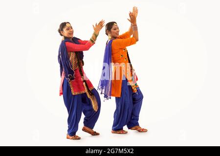 Two Giddha Dancers performing a dance step together Stock Photo - Alamy
