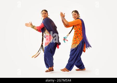 Two Giddha Dancers performing a dance step together Stock Photo - Alamy
