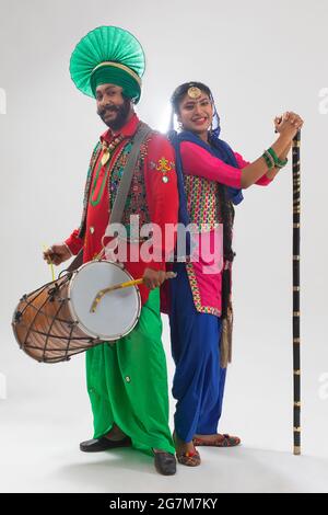 A Bhangra Dancer performing with Khunda Stock Photo - Alamy