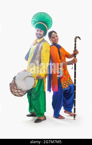 A Bhangra Dancer performing with Khunda Stock Photo - Alamy