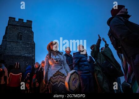 Summer Solstice celebrations on Glastonbury Tor with revellers ...