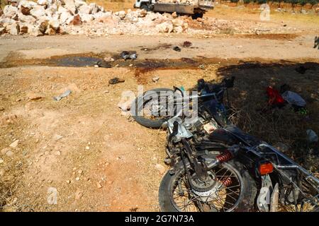 Idlib, Syria. 15th July, 2021. A man holds in his hand the remnants of ...