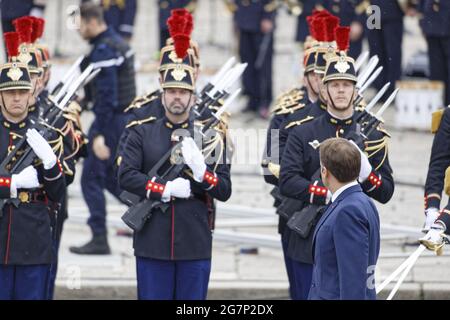 French President Emmanuel Macron reviews the Republican Guards during ...