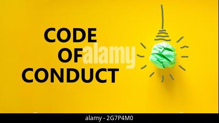 Code of ethics symbol. Green shining light bulb icon. Words 'Code of ...