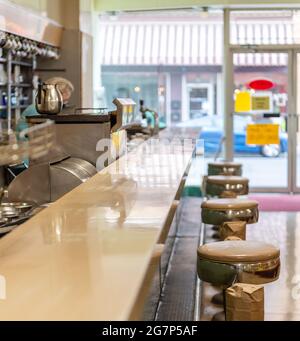 Vintage, original counter at a diner with chrome equipment from the ...