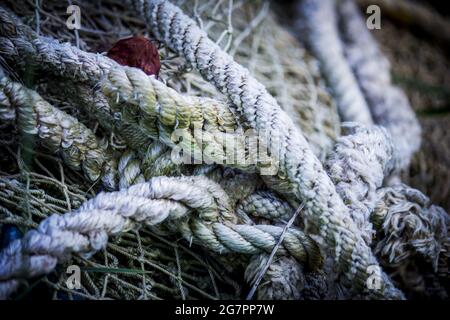 Closeup shot of a weathered net and ropes on a blurred background Stock ...