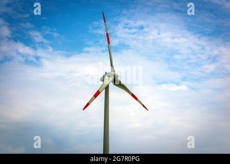 Single windmill generating electricity against blue sky.Beautiful wind ...