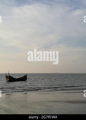 Vertical Shot of a Small Lonely Boat Floating in the Sea at El Pajar ...