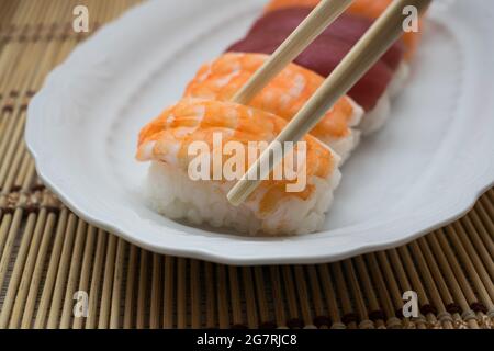 Chopsticks holding shrimp, tuna, salmon cubes. Hand-painted watercolor ...