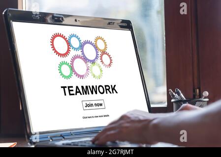 Laptop screen displaying a teamwork concept Stock Photo - Alamy