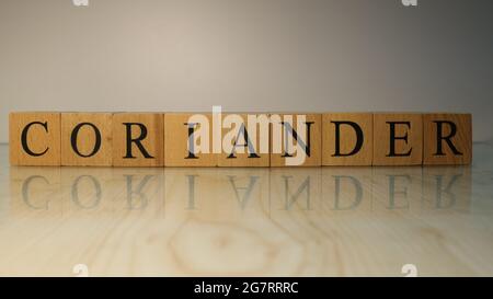 The word Coriander was created from wooden letter cubes. Gastronomy and ...