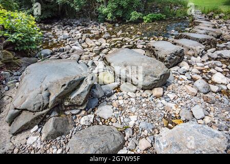 Stepping stones across Stainforth Beck in the village of Stainforth ...