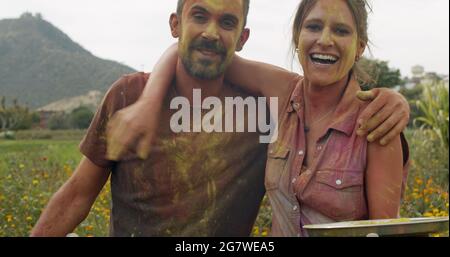 Happy couple with painted faces at the Holi Hindu festival of Color in ...