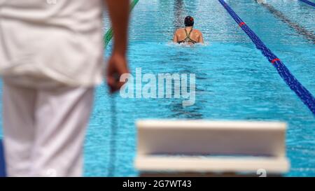 Woman swimming laps Stock Photo - Alamy