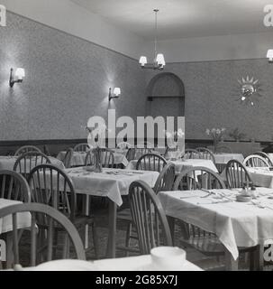 Empty restaurant with tables covered by white and blue tableware ready ...