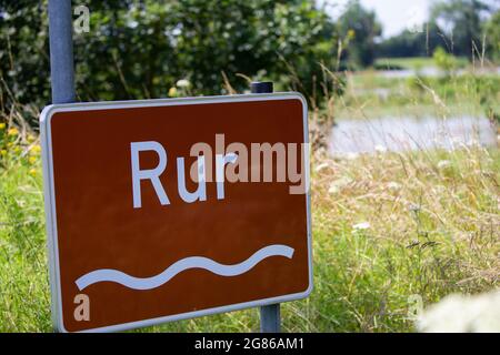 Orsbeck, Germany. 17th July, 2021. A sign near flooded meadows near ...