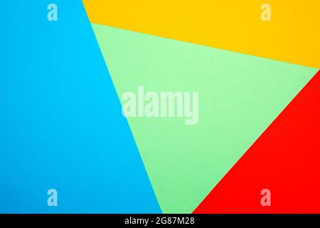 Colored triangles made of paper, colorful paper background in pastel ...