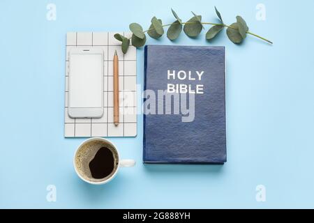 Holy Bible, cup of coffee and eucalyptus branch on wooden background ...