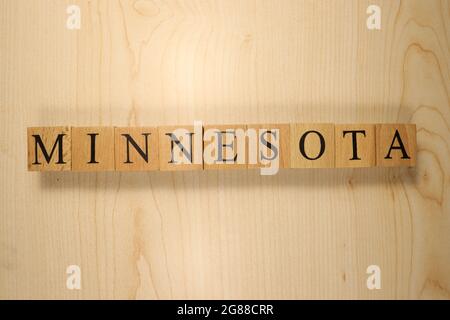 The word Minnesota was created from wooden letter cubes. Cities and ...