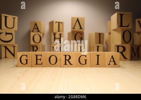 The word Georgia was created from wooden letter cubes. Cities and words ...