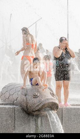 People cool off at a fountain in Rome, Tuesday, June 23, 2026. (AP ...