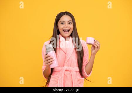 good morning. kid wear soft nightsuit play with toy. child in cozy ...