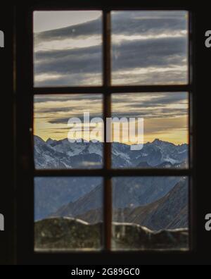 View through a window of the Austrian Alps Stock Photo - Alamy