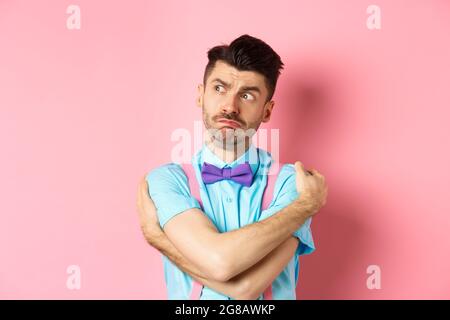 Timid guy feeling offended and lonely, embracing body, comforting ...